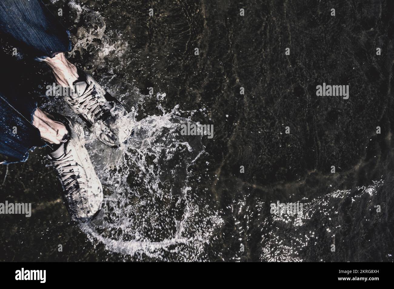 Legs splashing water on beach hi-res stock photography and images - Alamy