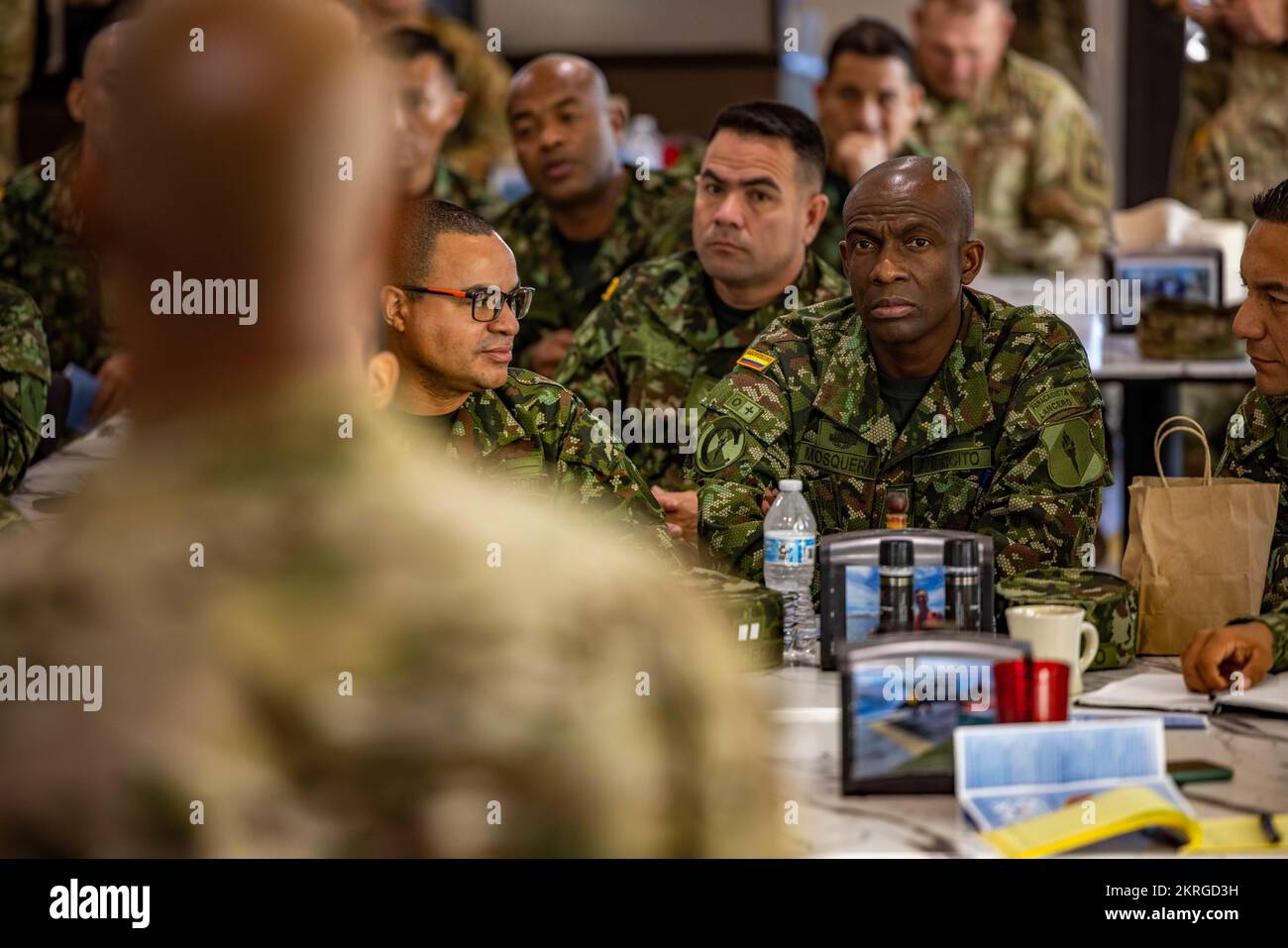 Colombian army soldier, Sgt. Maj. Eli Mosquera Cruz, listens to a ...