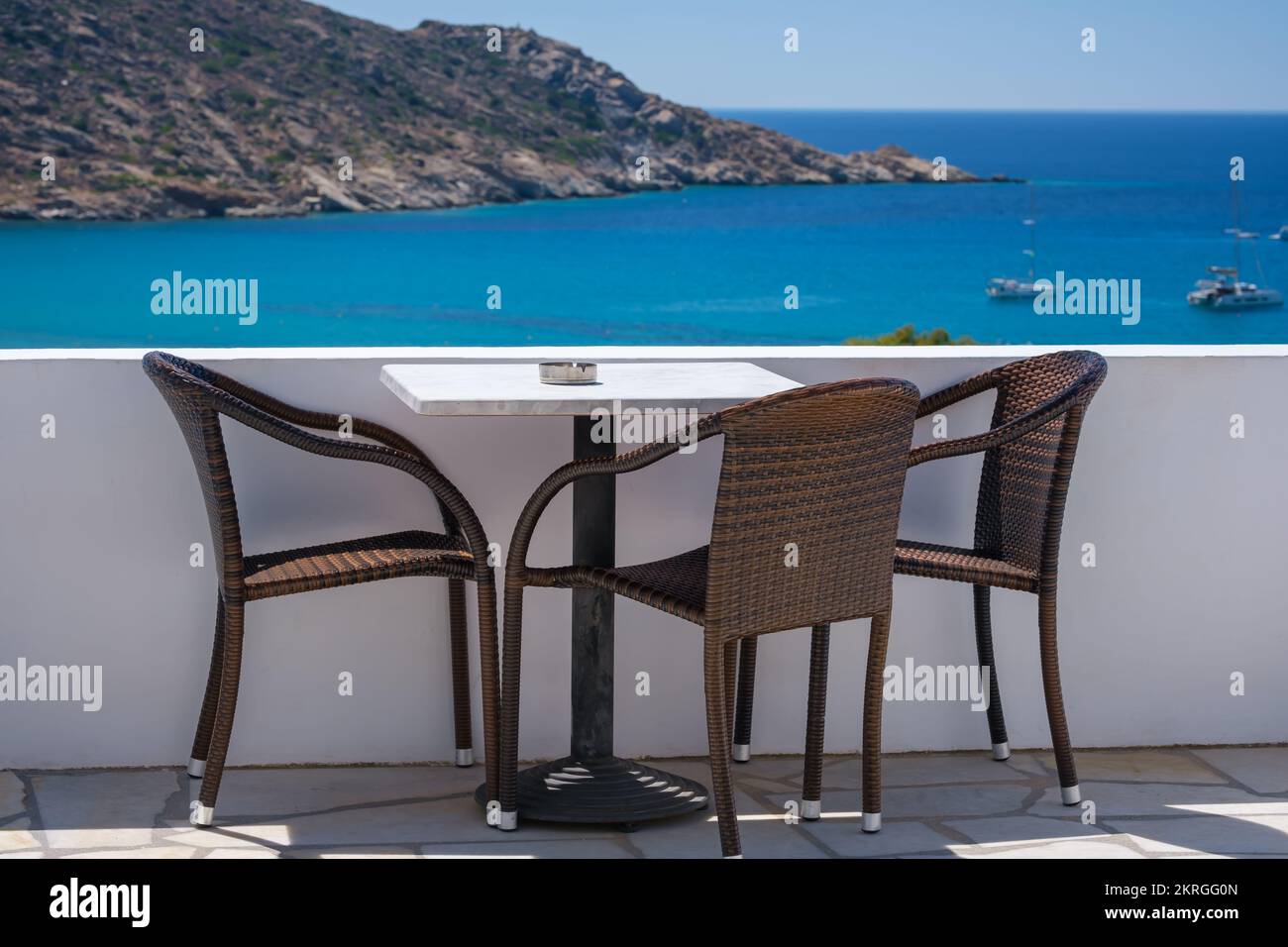 Amazing view from a balcony with chairs and a table overlooking the ...