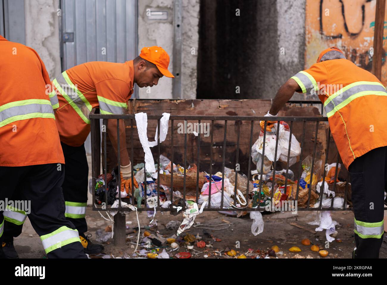 Keeping the city clean. a team of garbage collectors Stock Photo - Alamy