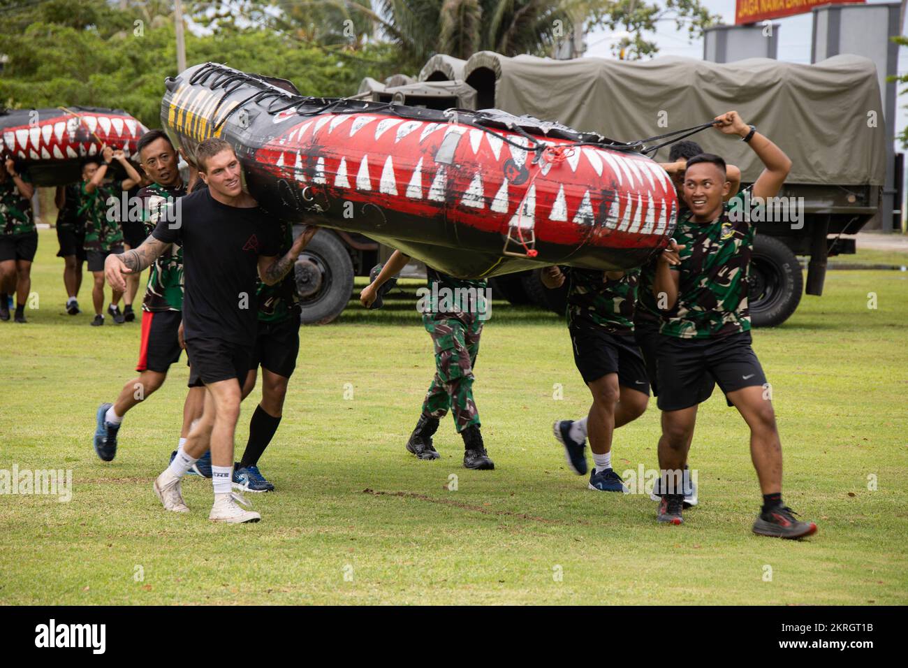 U.S. Marine Corps Cpl. Jordan Buisch, center, a radio operator with 1st ...