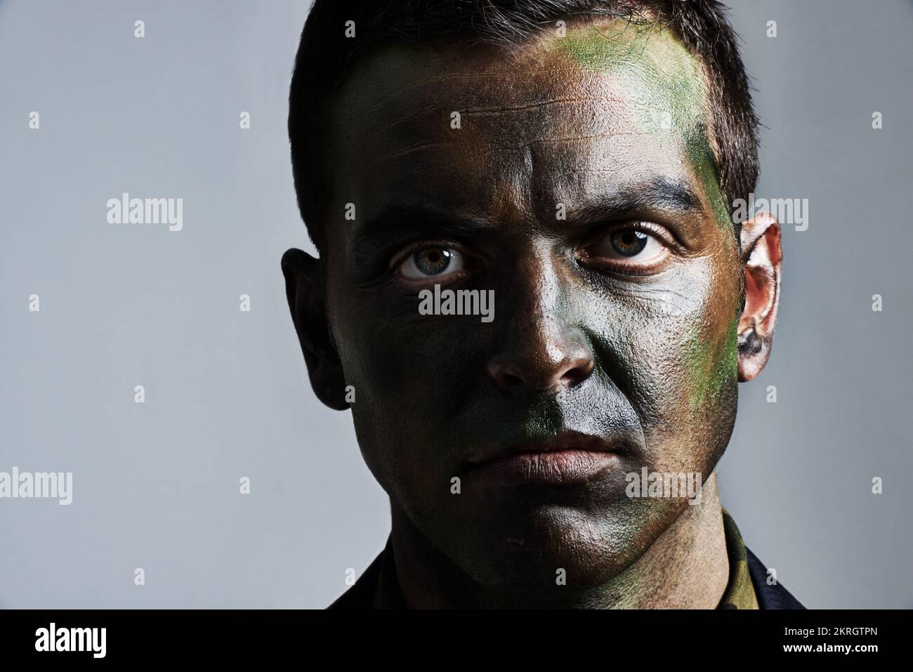 Ready for war. A young military man wearing camouflage facepaint Stock ...
