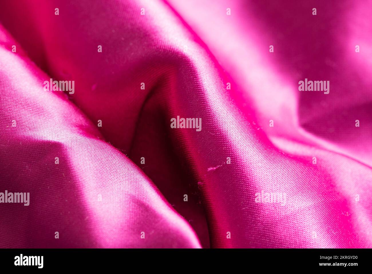 Pink shiny fabric, background macro Stock Photo - Alamy
