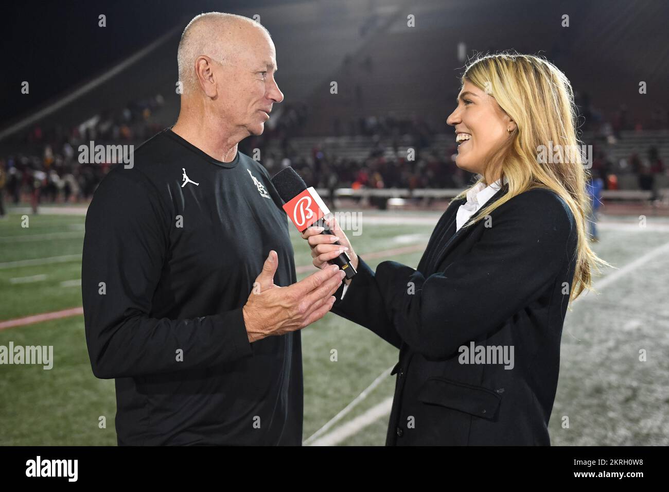 Los Alamitos Griffins head coach Ray Fenton (left) is interviewed by ...