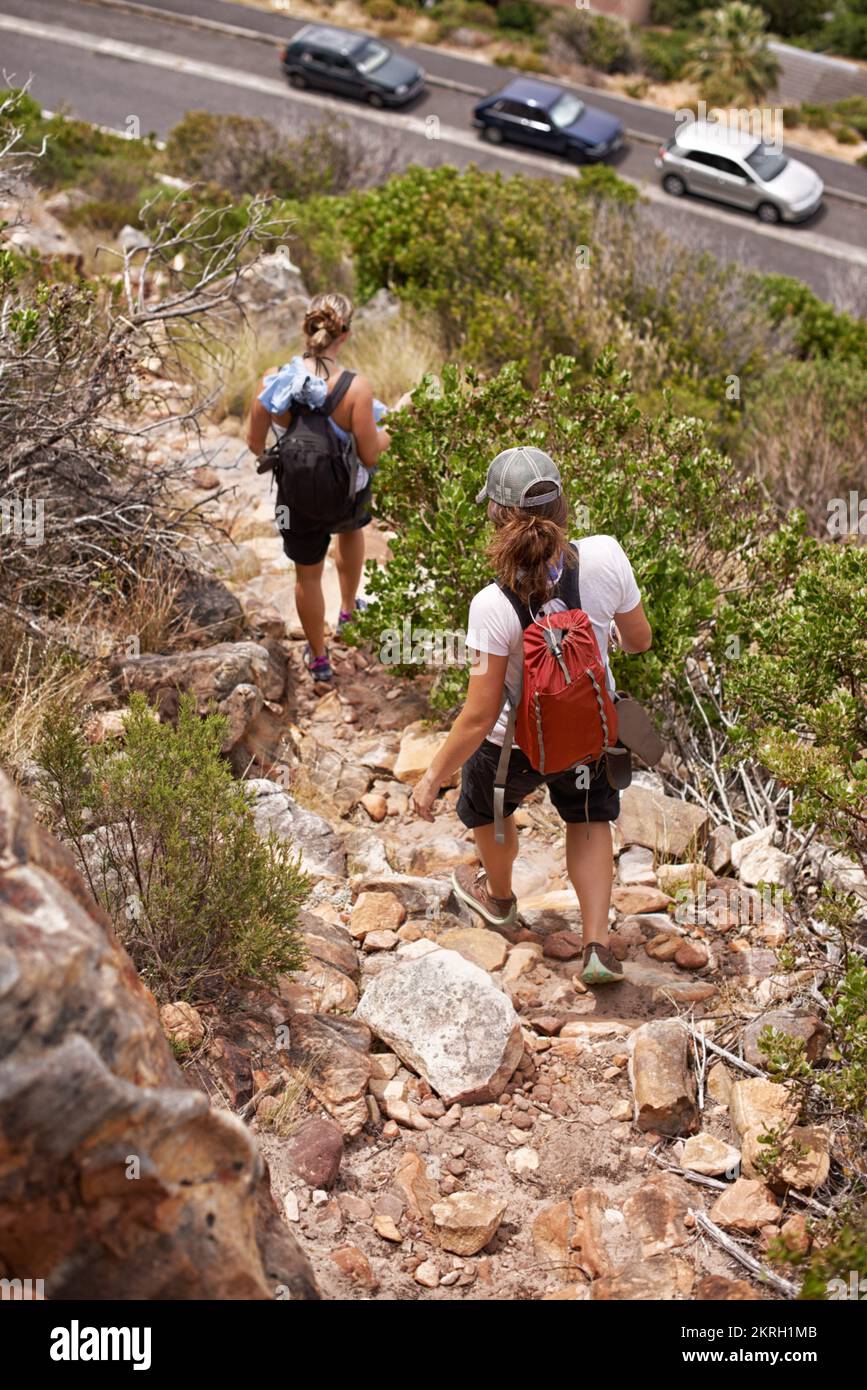 The end of the day. Two young women walking back to their cars after a ...