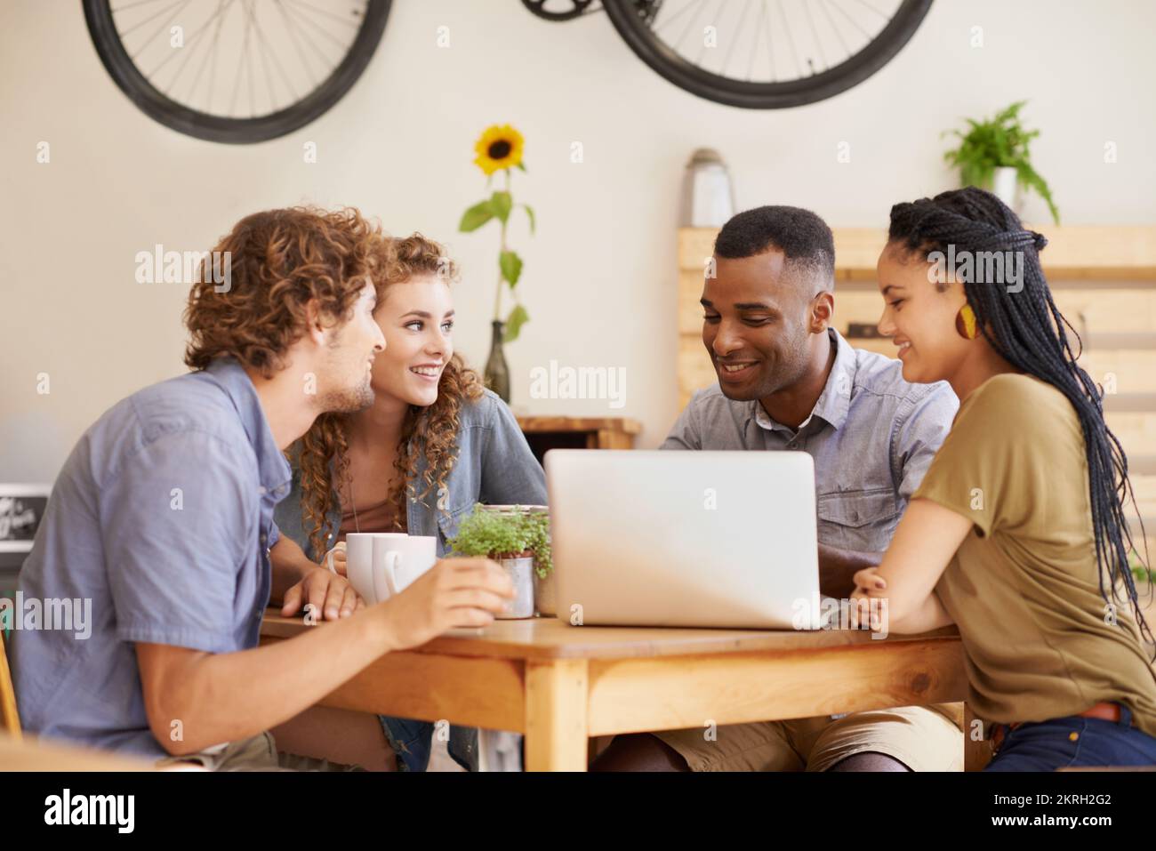 Hanging out at their favorite cafe. A group of friends hanging out in a ...