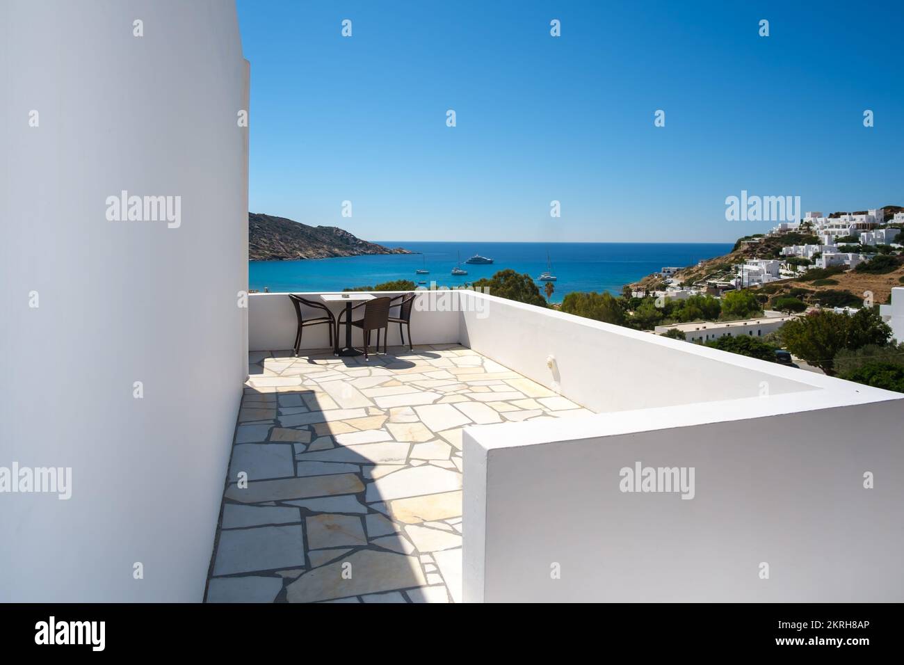 Amazing view from a balcony with chairs and a table overlooking the ...