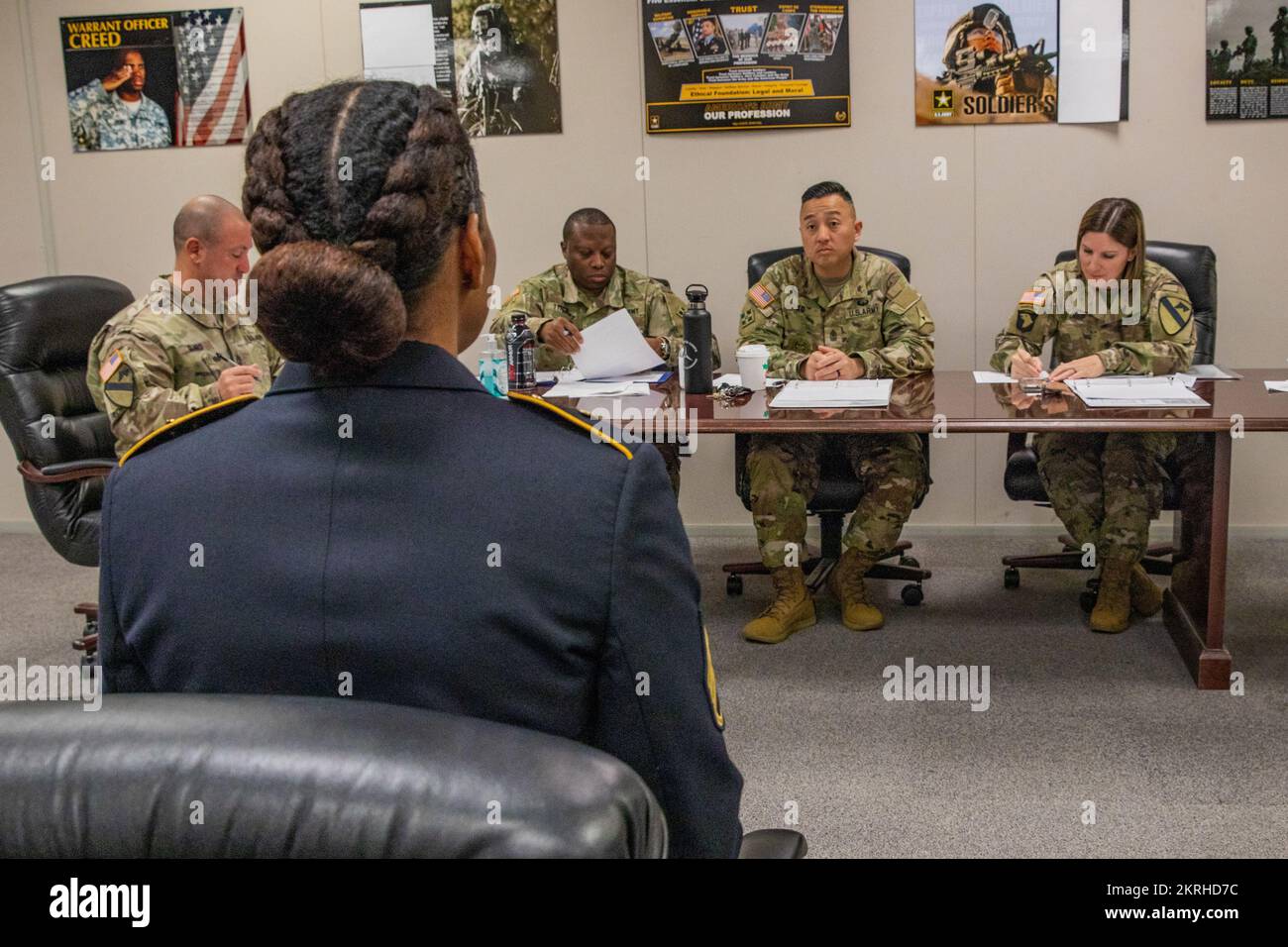 Senior paralegal NCOs discuss a Soldier's qualifications with their ...