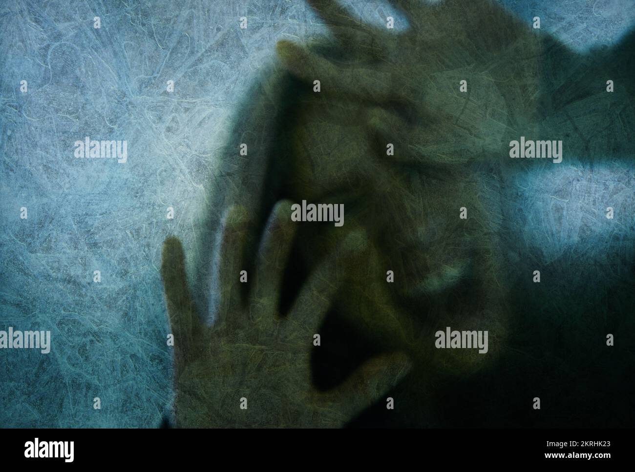 Trapped and desperate. woman behind a glass wall during quarantine ...