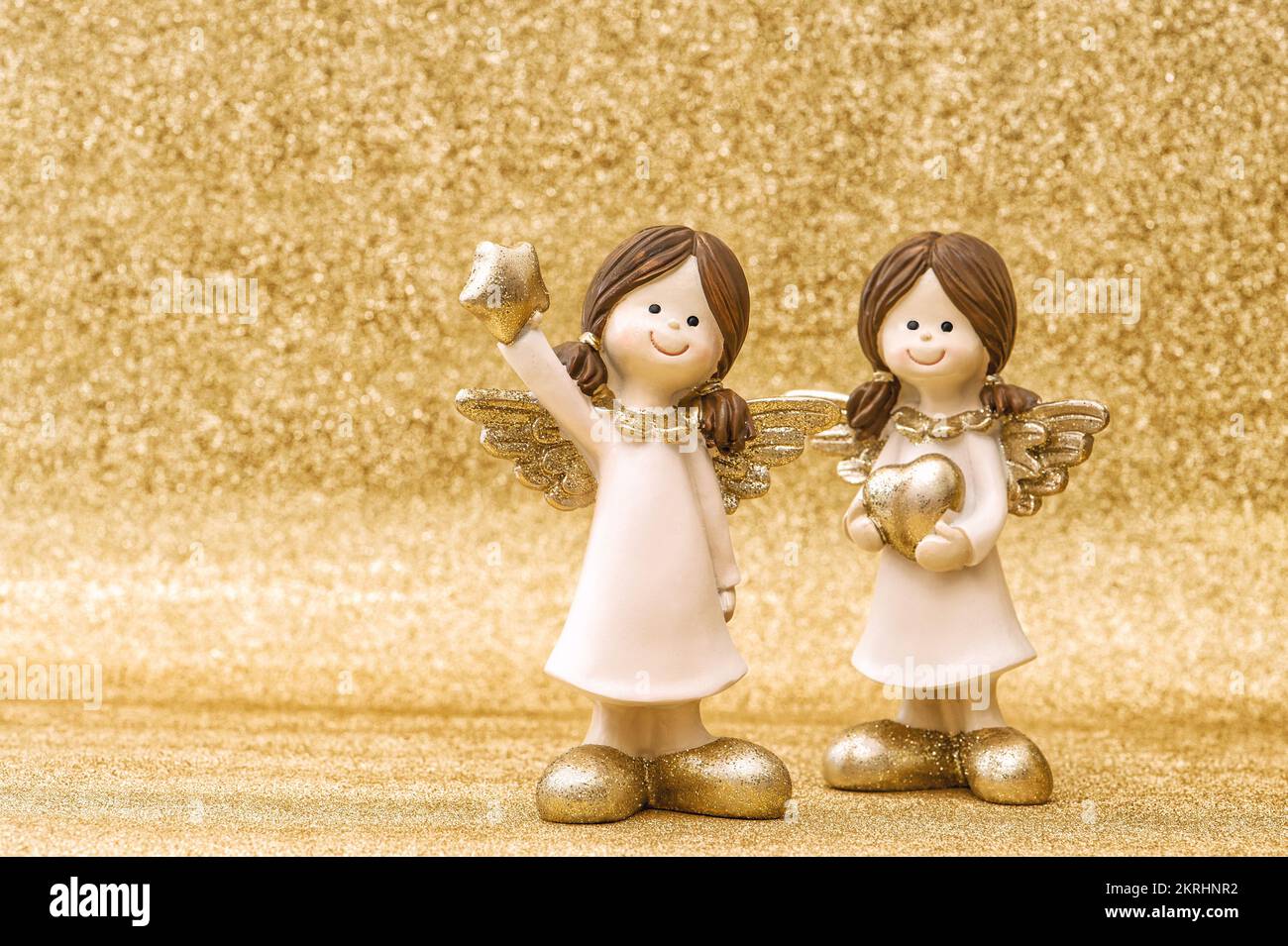 Christmas decoration Little guardian angels golden background Stock ...