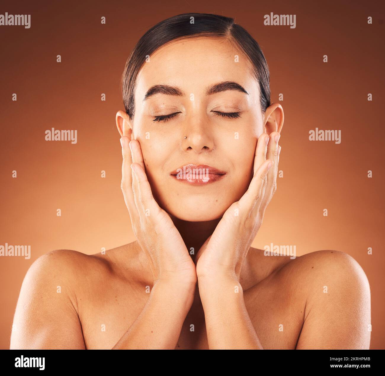 Cosmetics, skincare and young woman with natural beauty, smooth and clear skin against brown ...