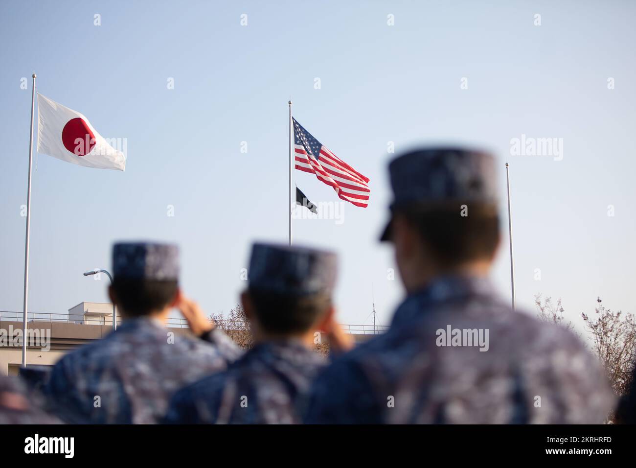 Japan Maritime Self-Defense Force members with Fleet Air Wing 31 salute ...