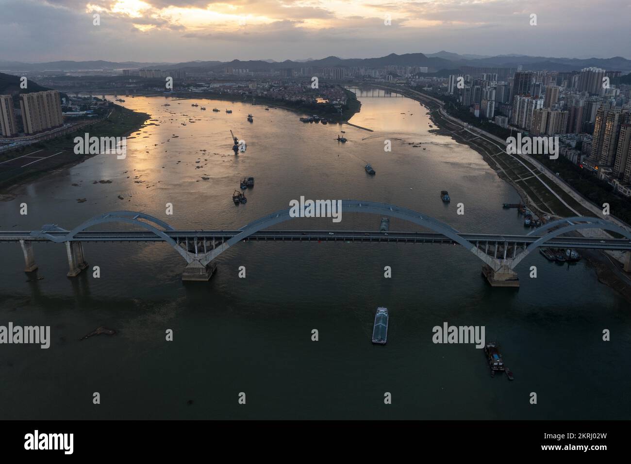 Aerial photos show cargo ships are busy shuttling in the Wuzhou section of the Xi River in ...