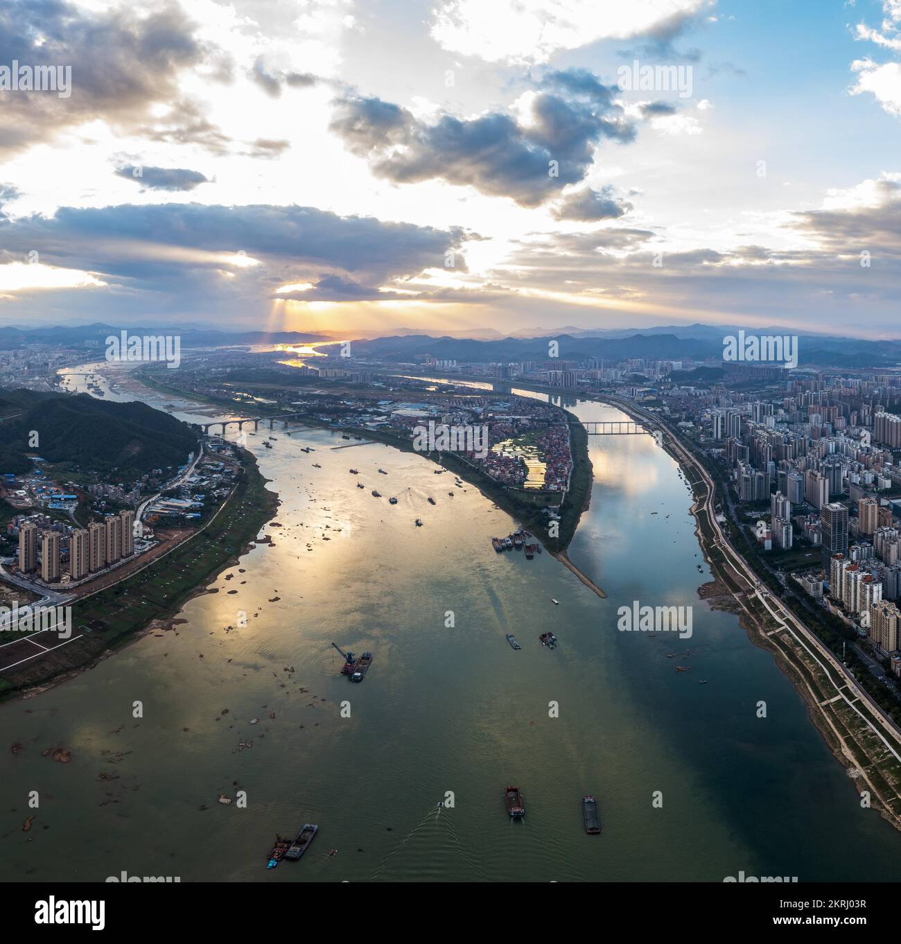 Aerial photos show cargo ships are busy shuttling in the Wuzhou section of the Xi River in ...
