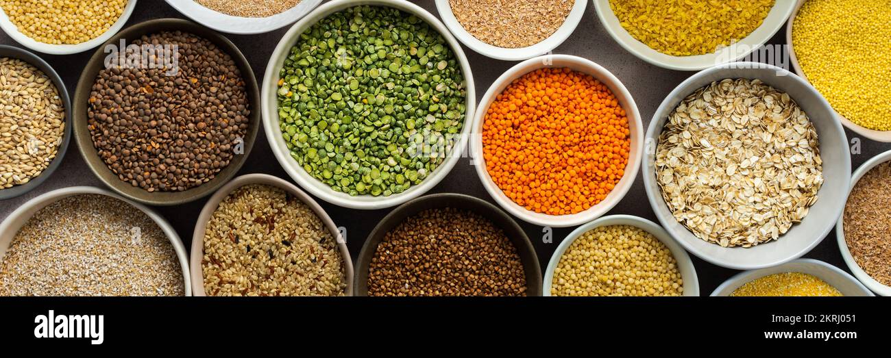 Various grain cereals in bowls banner, top view Stock Photo - Alamy