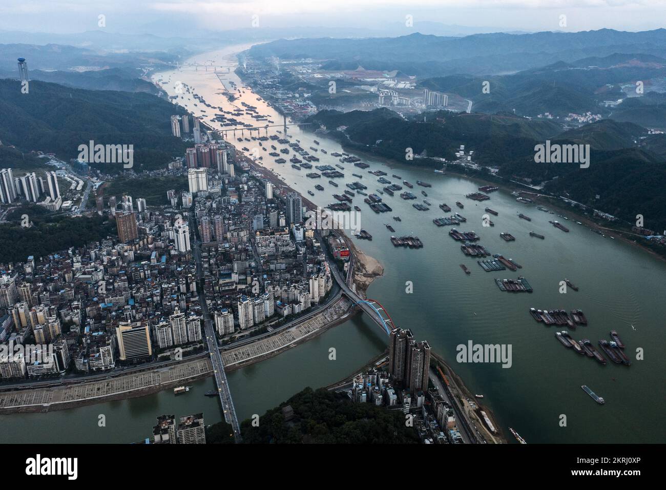 Aerial photos show cargo ships are busy shuttling in the Wuzhou section of the Xi River in ...