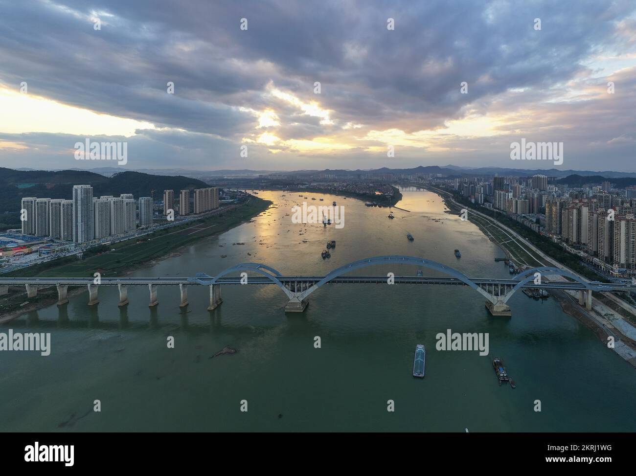 Aerial photos show cargo ships are busy shuttling in the Wuzhou section of the Xi River in ...