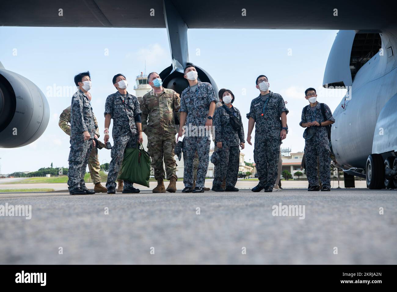 U.S. Air Force Master Sgt. James Lee, third from the left, 733rd Air ...