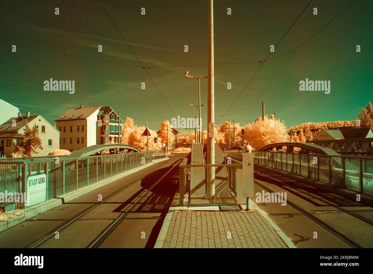bridge over the river with tram tracks and infrared city landscape ...