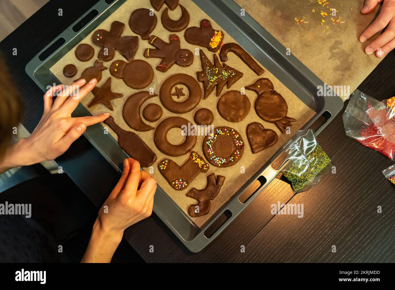 Top view of a baking sheet with gingerbread biscuits of different ...