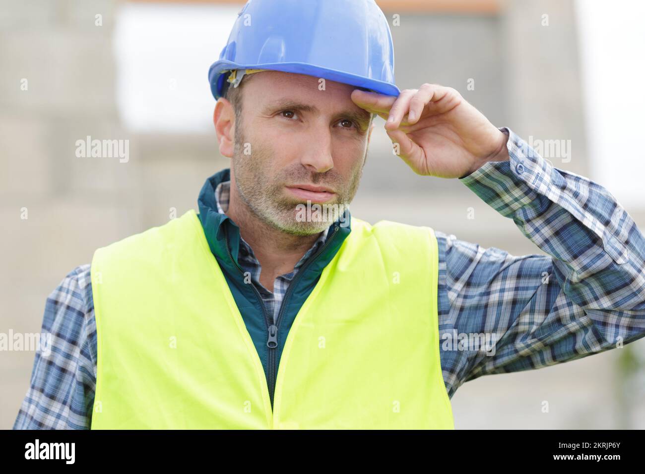 Sad tired construction worker hi-res stock photography and images - Alamy