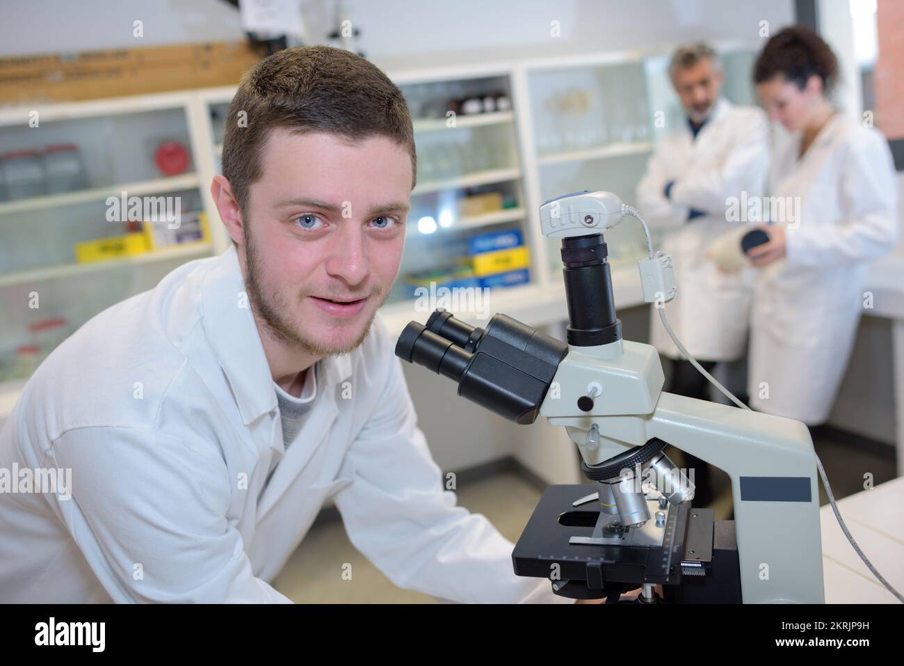 positive delighted scientist looking into microscope Stock Photo - Alamy positive delighted scientist looking into microscope Stock Photo - Alamy