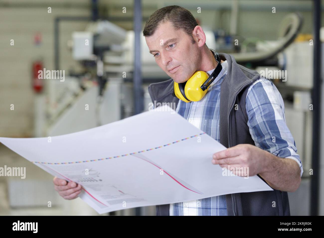 engineer is checking the structure of building on a blueprint Stock ...