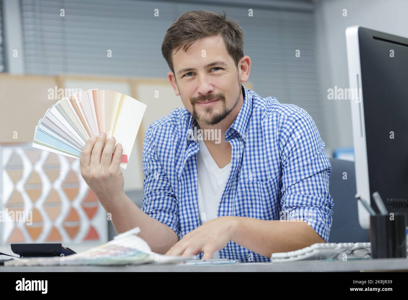 professional painter showing a set of color swatches Stock Photo - Alamy