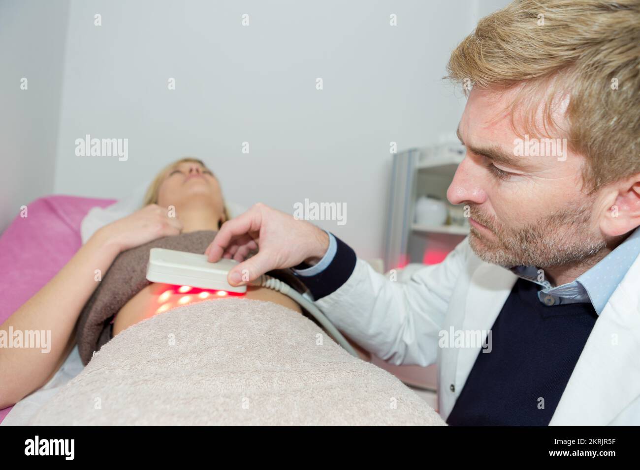doctor operating ultrasound scanner Stock Photo - Alamy