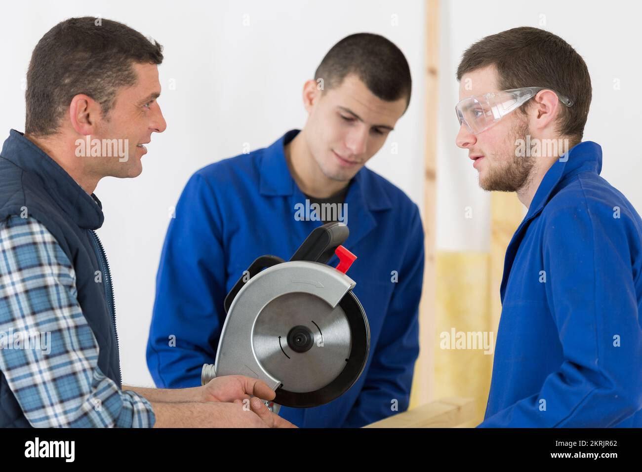 men around the drop saw Stock Photo - Alamy