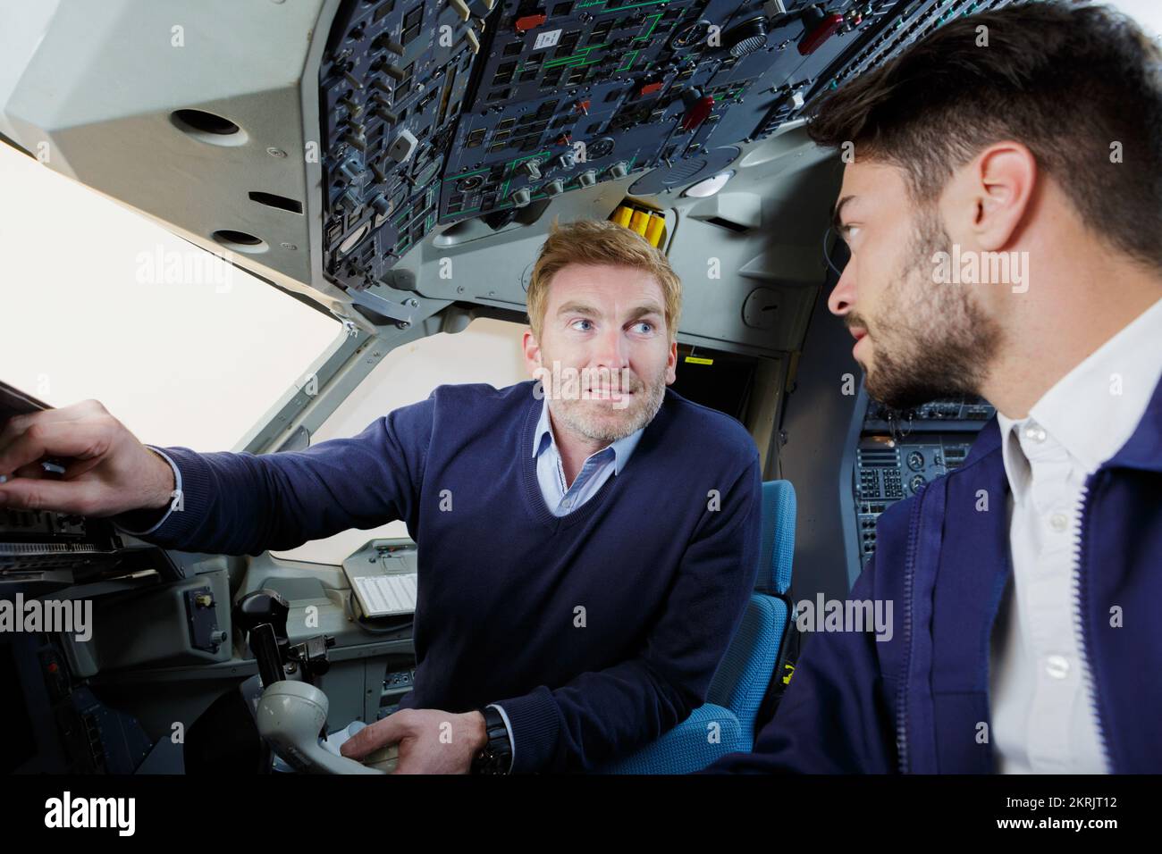 pilot and apprentice in cockpit Stock Photo - Alamy