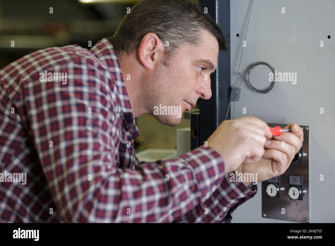electrician working in house on construction site Stock Photo - Alamy
