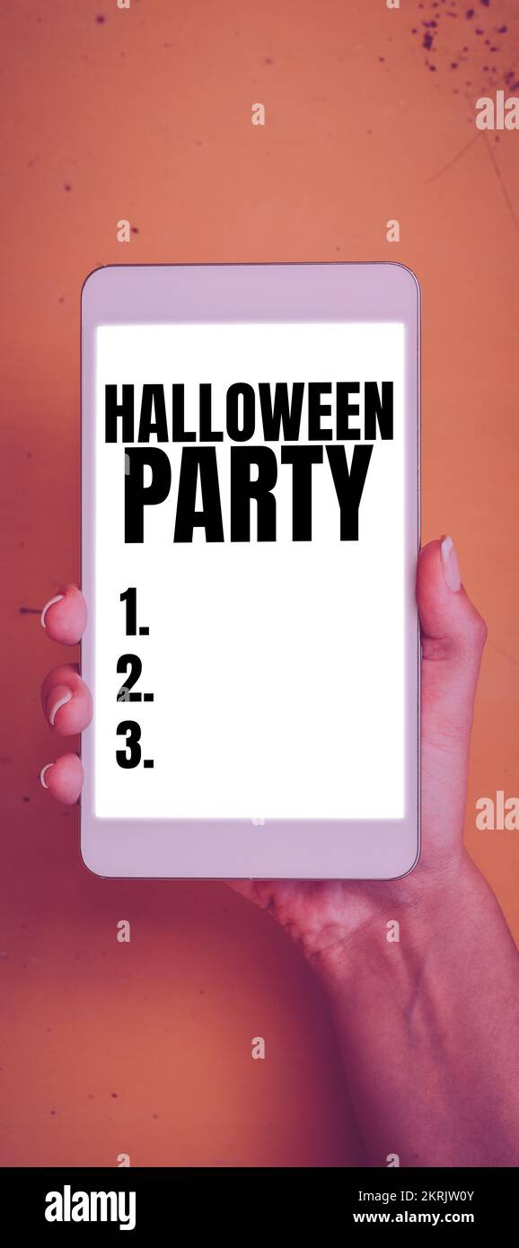 Hand writing sign Halloween Party, Word Written on eve of the Western ...
