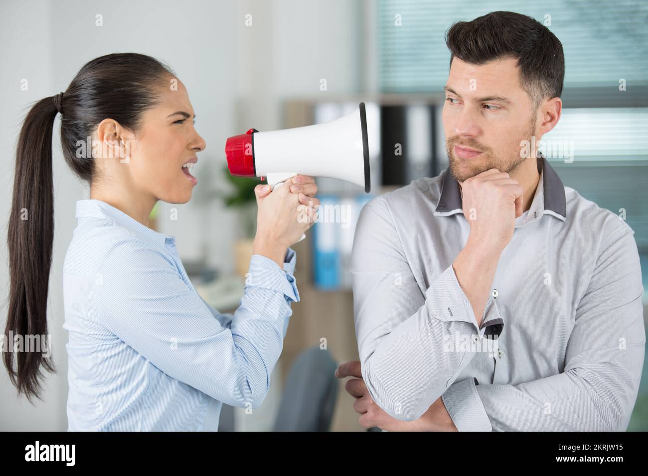 Woman screaming through loudspeaker hi-res stock photography and images ...