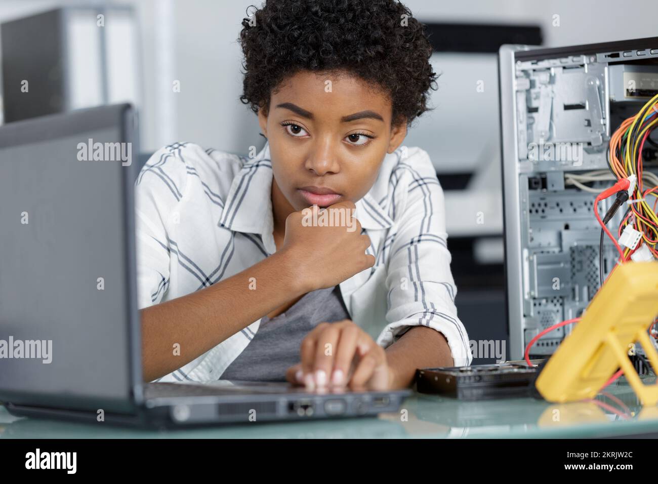 woman during hard drive repair Stock Photo - Alamy