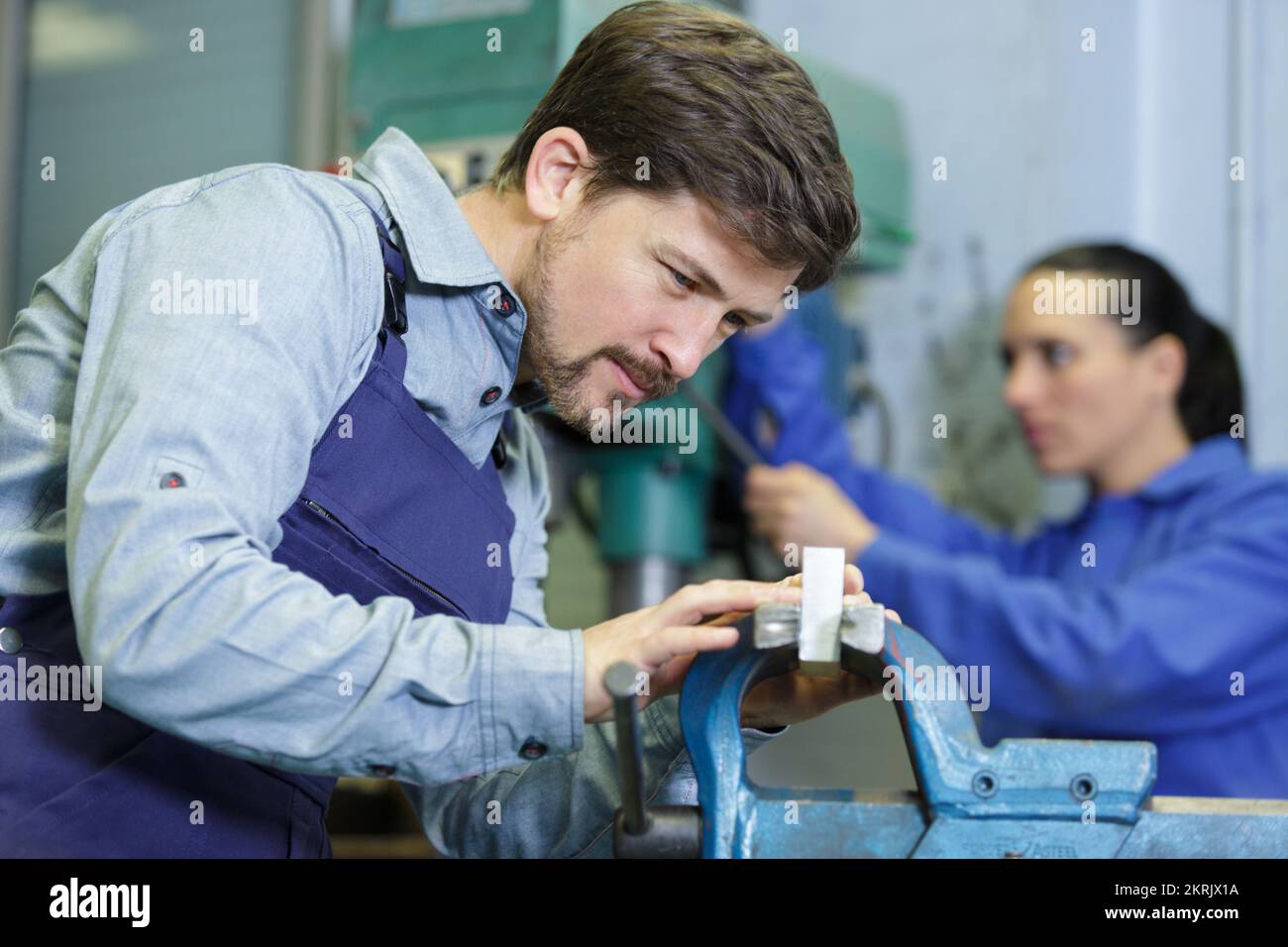 industrial metal machining worker in factory Stock Photo - Alamy
