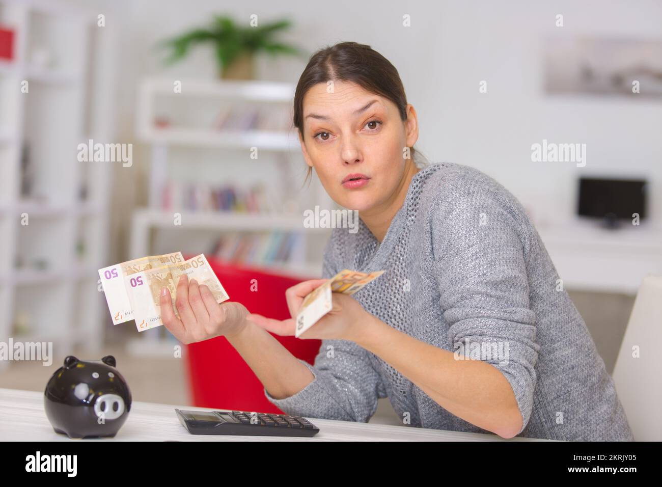 Woman economize hi-res stock photography and images - Alamy
