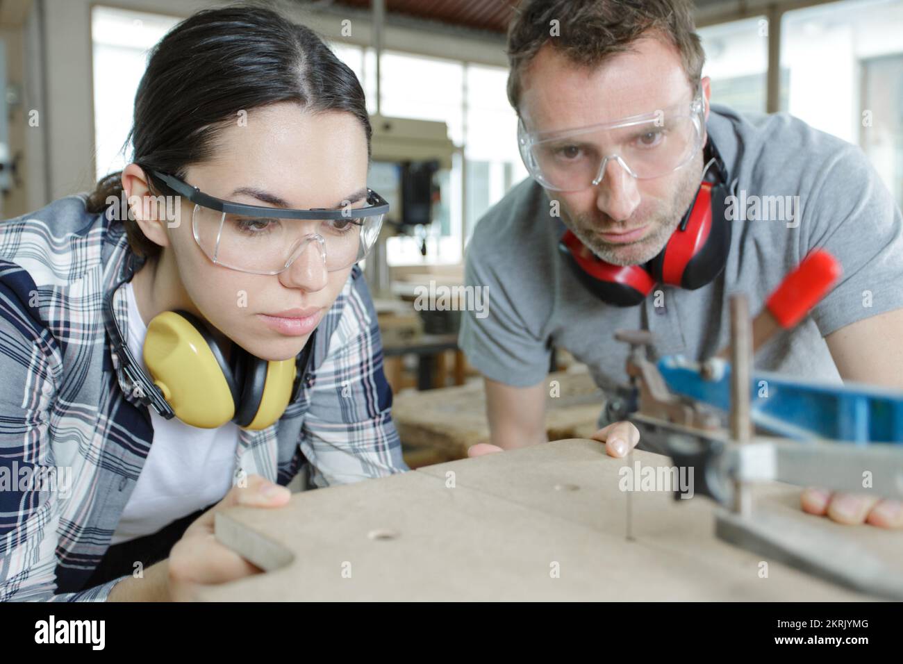 portrait of engineers working on factory machine Stock Photo - Alamy