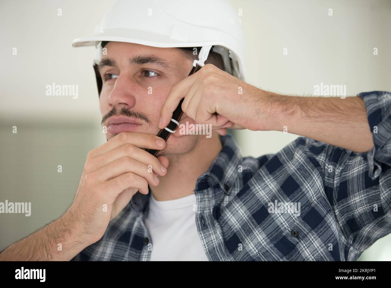 Engineer putting on helmet hi-res stock photography and images - Alamy