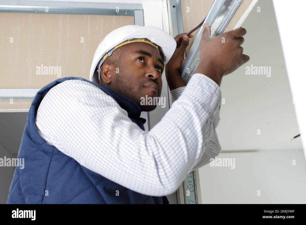 construction worker using spirit level in a new house Stock Photo - Alamy