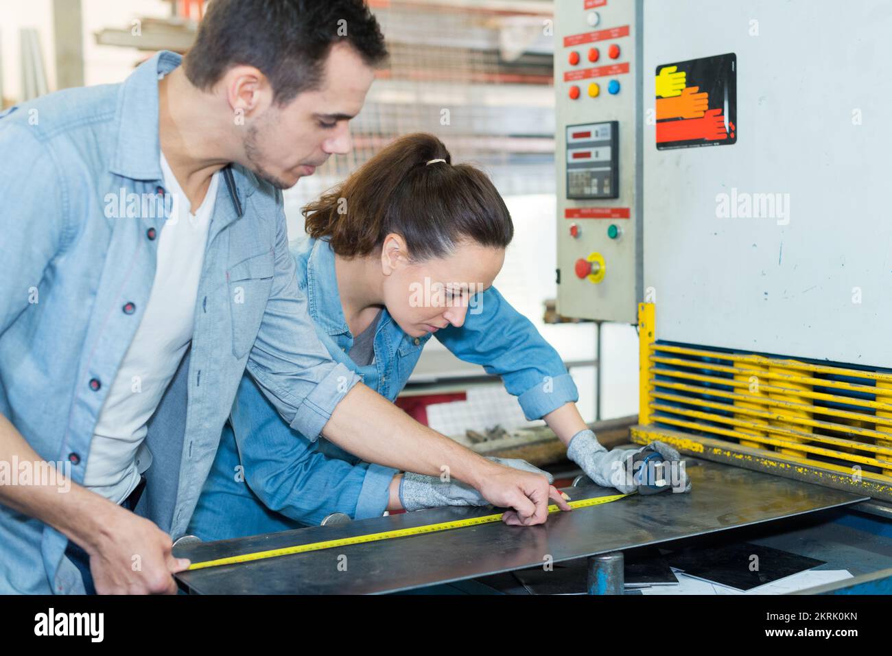 worker measuring galvanized iron plates Stock Photo - Alamy