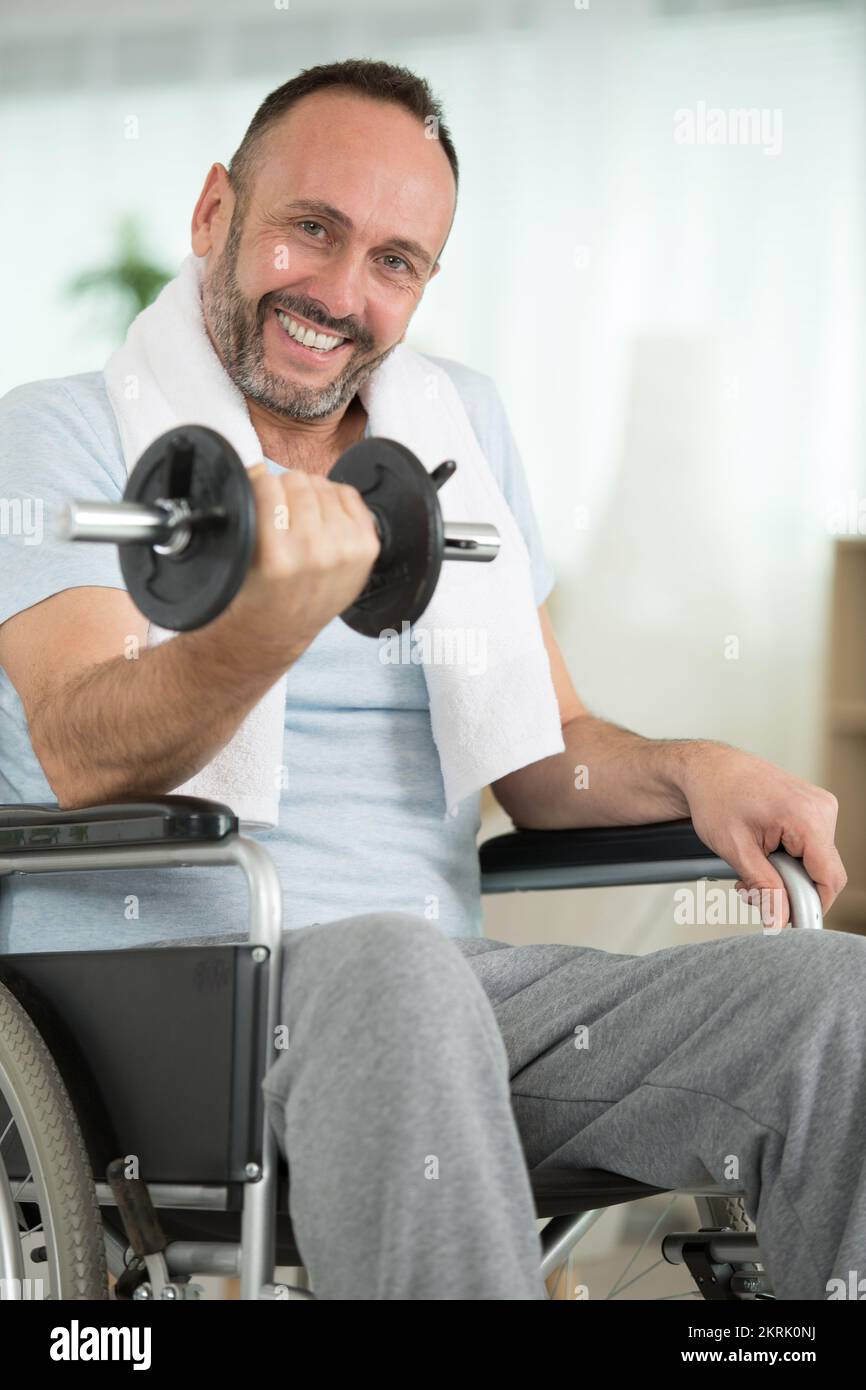 Man helping disable hi-res stock photography and images - Alamy