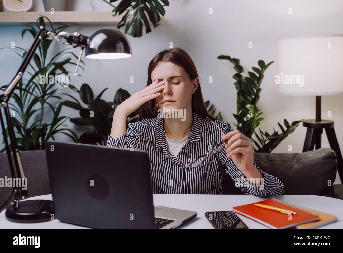 Stressed girl suffer from headache bad vision sight problem sit at home ...