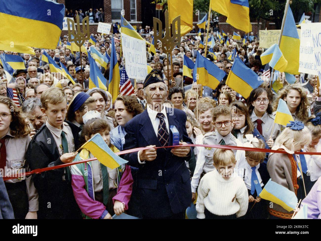 About 2,000 people carry signs and wave Ukrainian flags on Sept. 22 ...