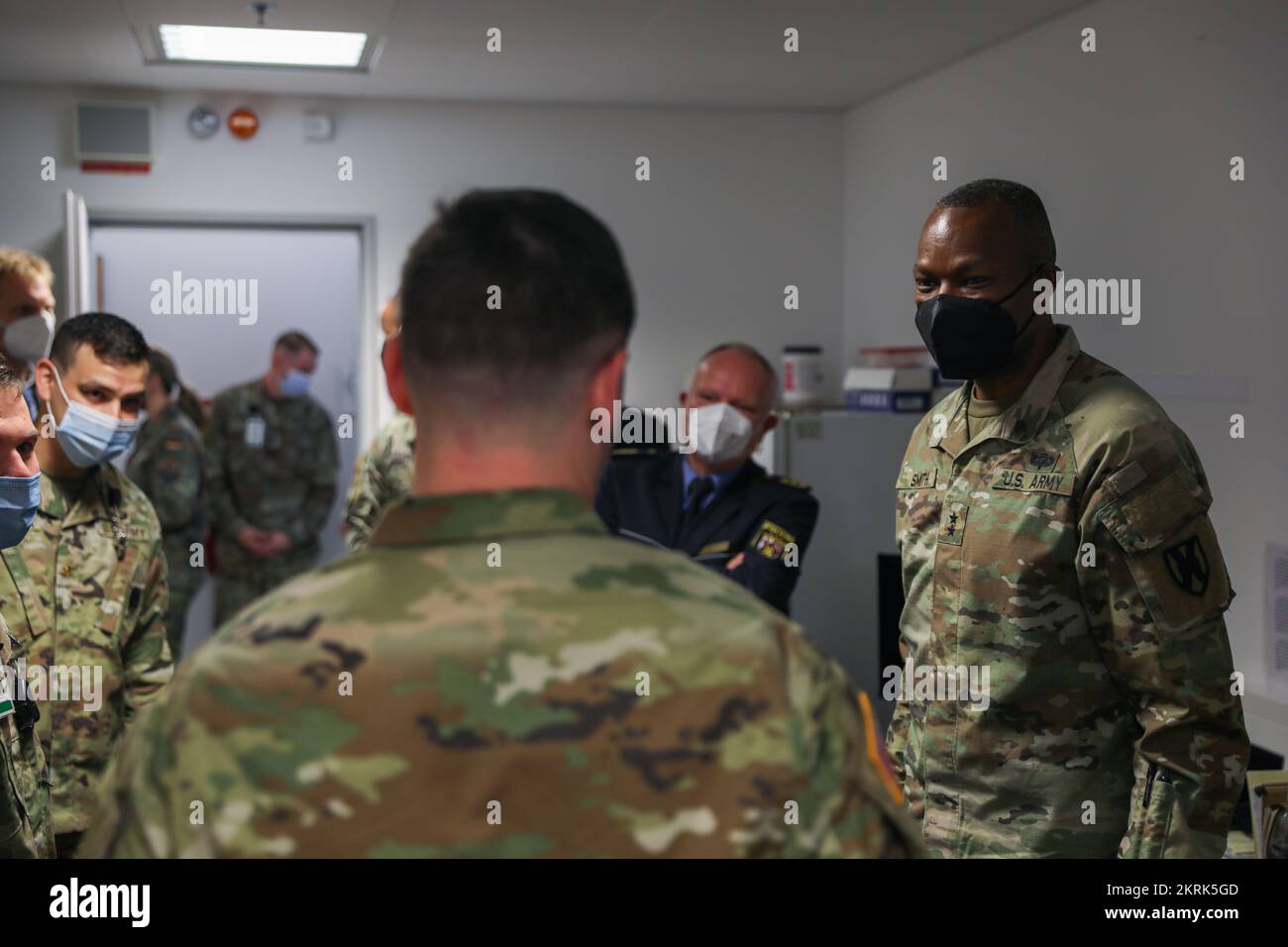 U.S. Army Maj. Gen. James M. Smith, 21st Theater Sustainment Command commander, is briefed by ...