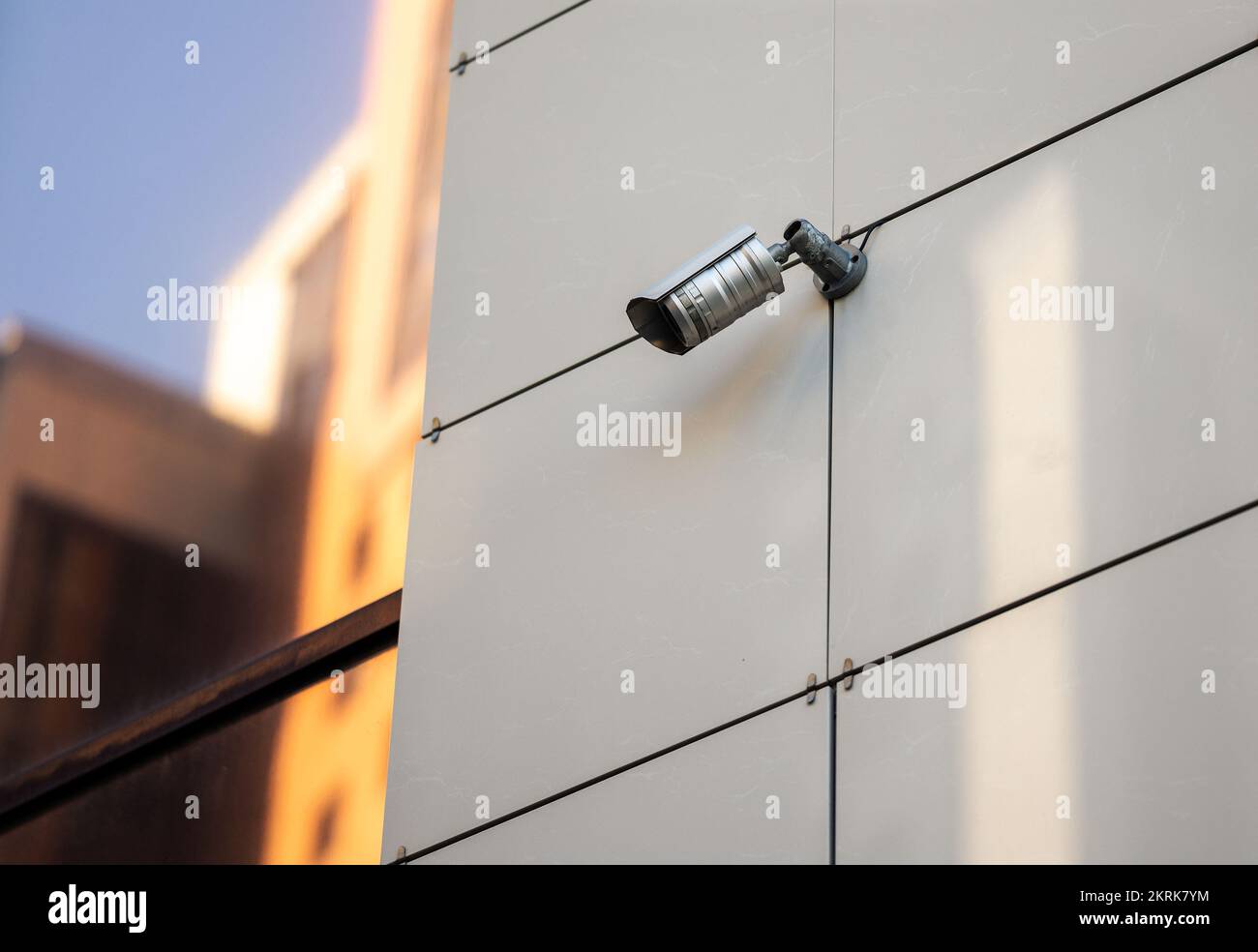 Surveillance camera on the wall of the building Stock Photo - Alamy