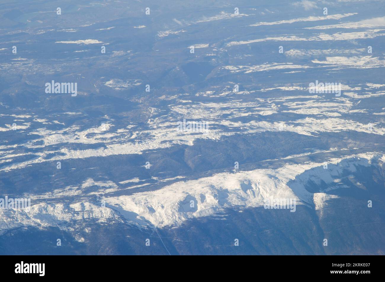 Aerial view of part of the territory of France with snow-covered areas ...