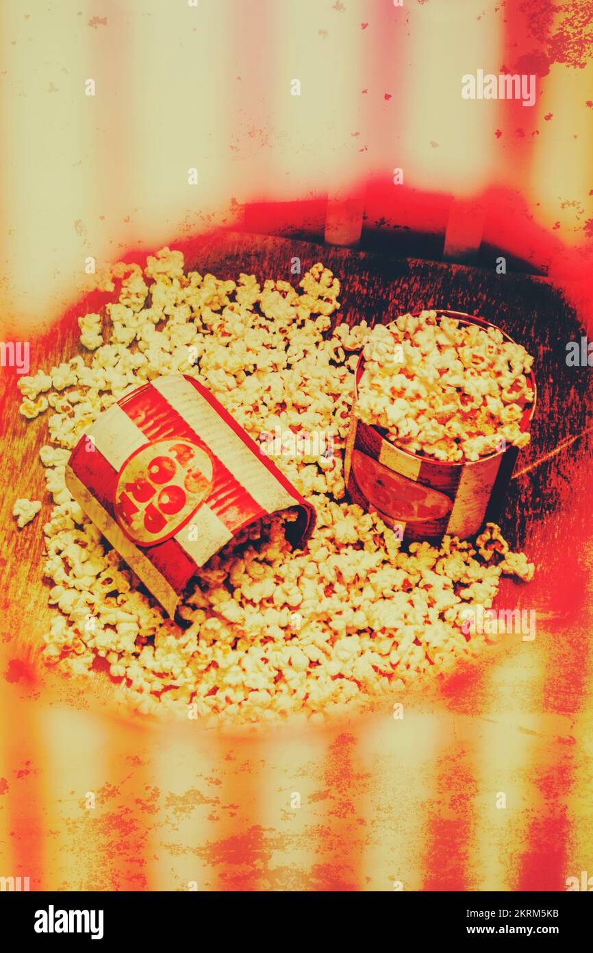 Freshly baked buttered crispy popcorn overflowing from classical ...