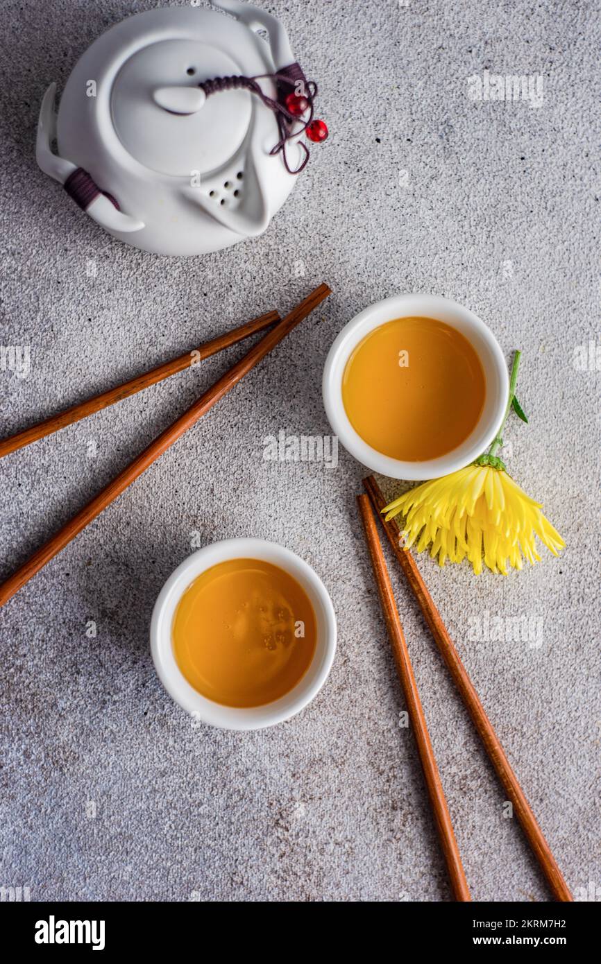 Top view of asian green tea set with yellow autumnal Chrysanth flowers ...