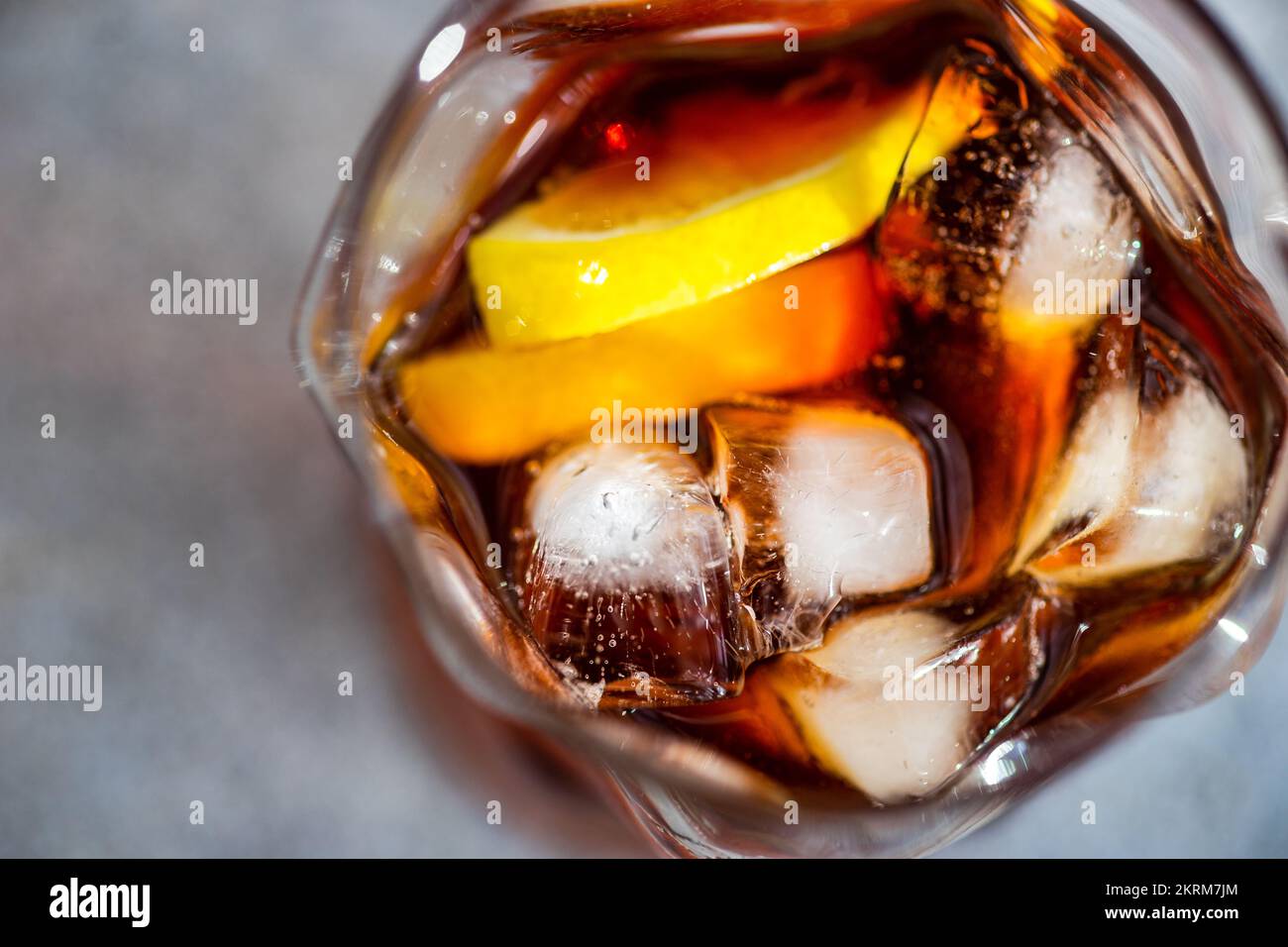 From above vodka Martini cocktail with ice and lemon served in the ...